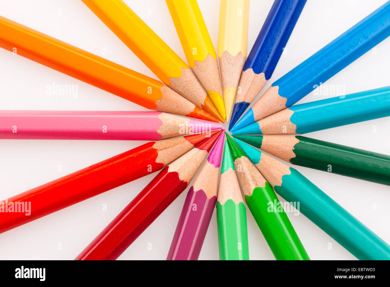 different colored pencils on white background Stock Photo - Alamy