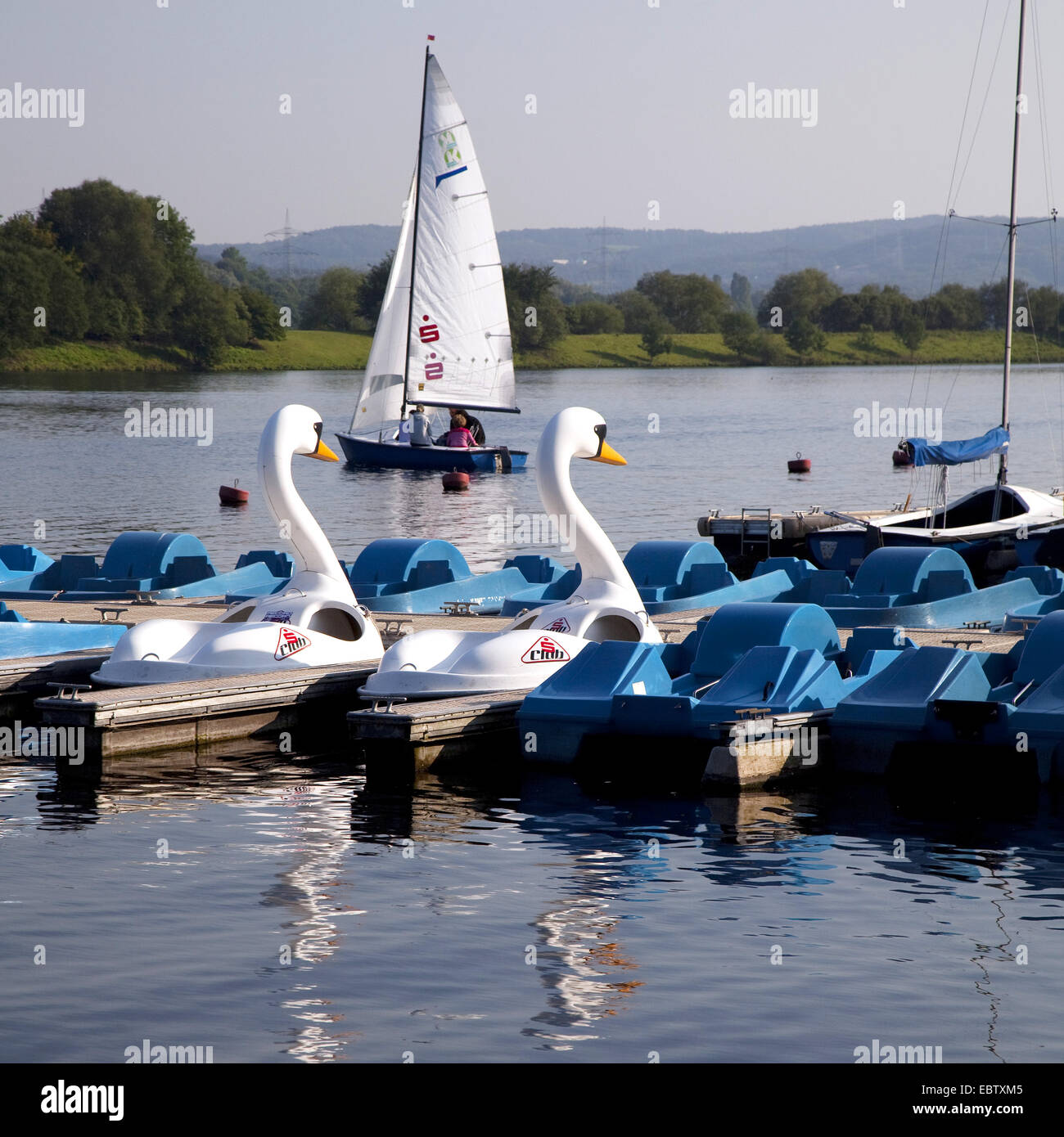 sailing boats and pedal swan shaped boats at landing stage in Heveney ...