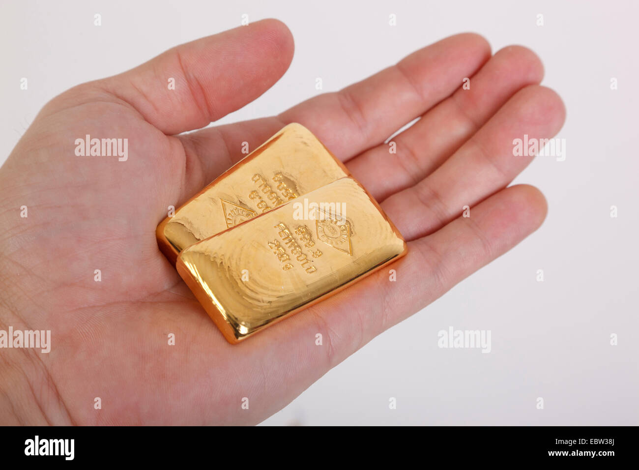 Gold bars in hand hi-res stock photography and images - Alamy