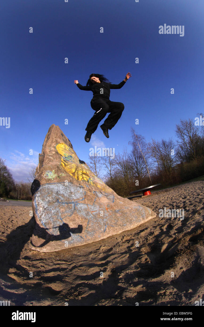 young woman jumping up Stock Photo - Alamy