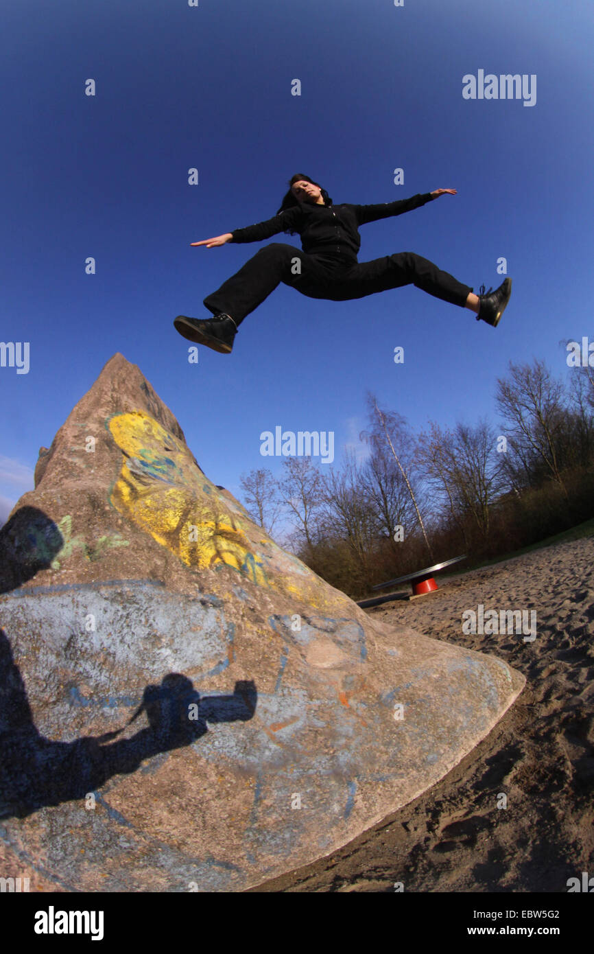 young woman jumping up Stock Photo - Alamy