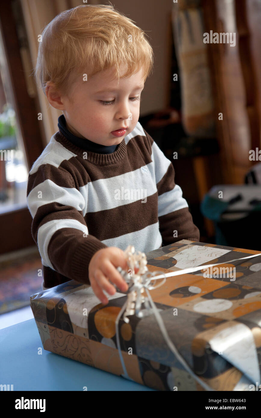 little boy opening a present on his second birthday Stock Photo - Alamy