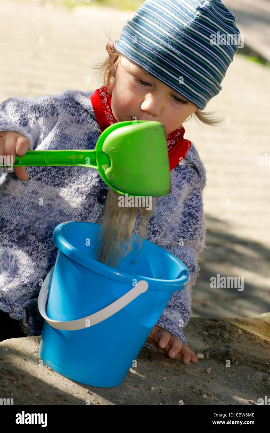 Boy playing sand pail shovel hi-res stock photography and images - Alamy