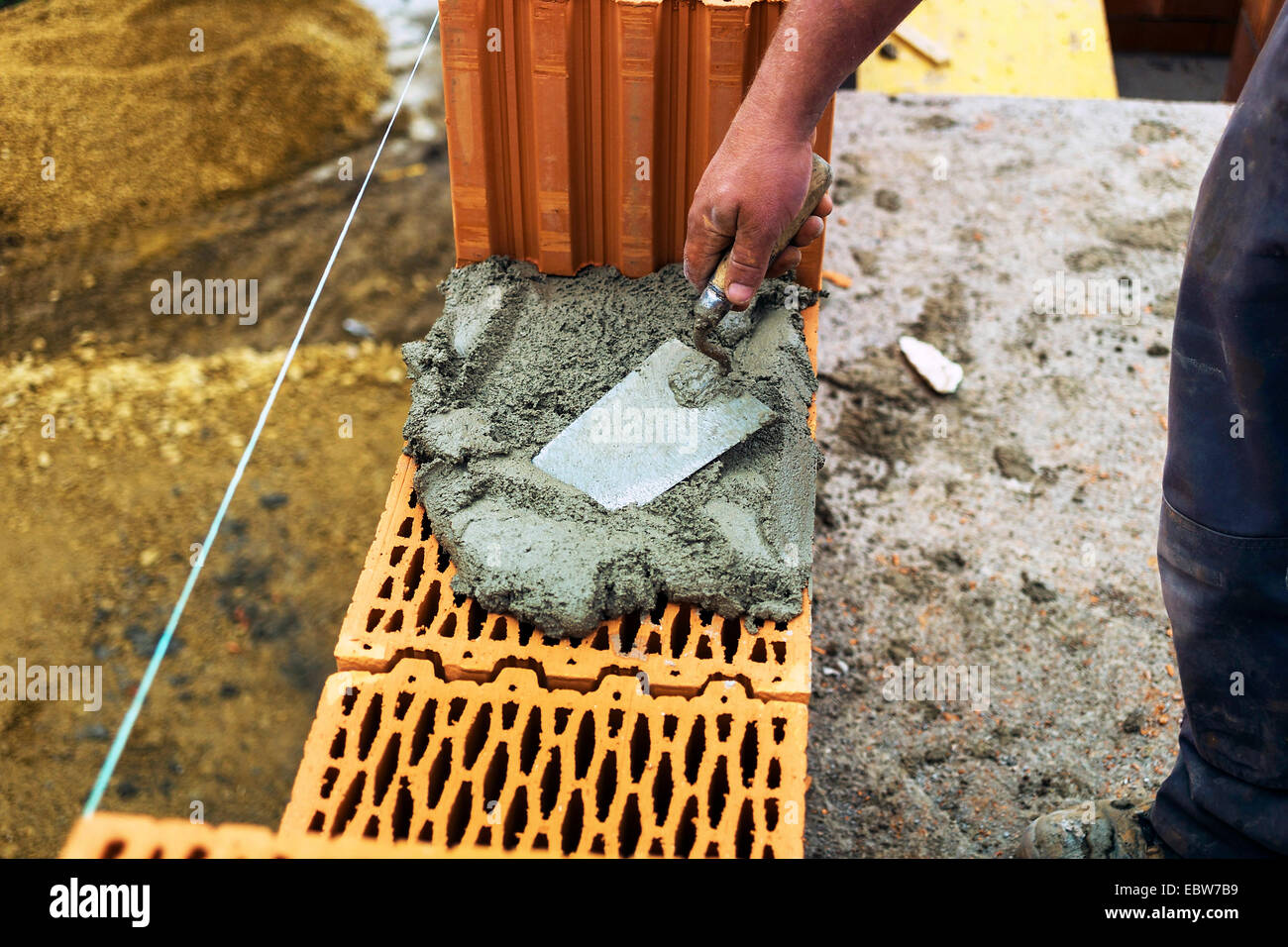 construction worker building a wall of a house, Austria Stock Photo - Alamy