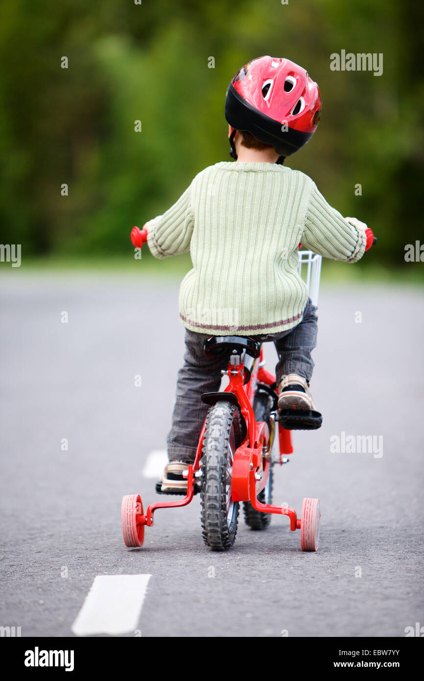 little boy cycling, back view Stock Photo - Alamy