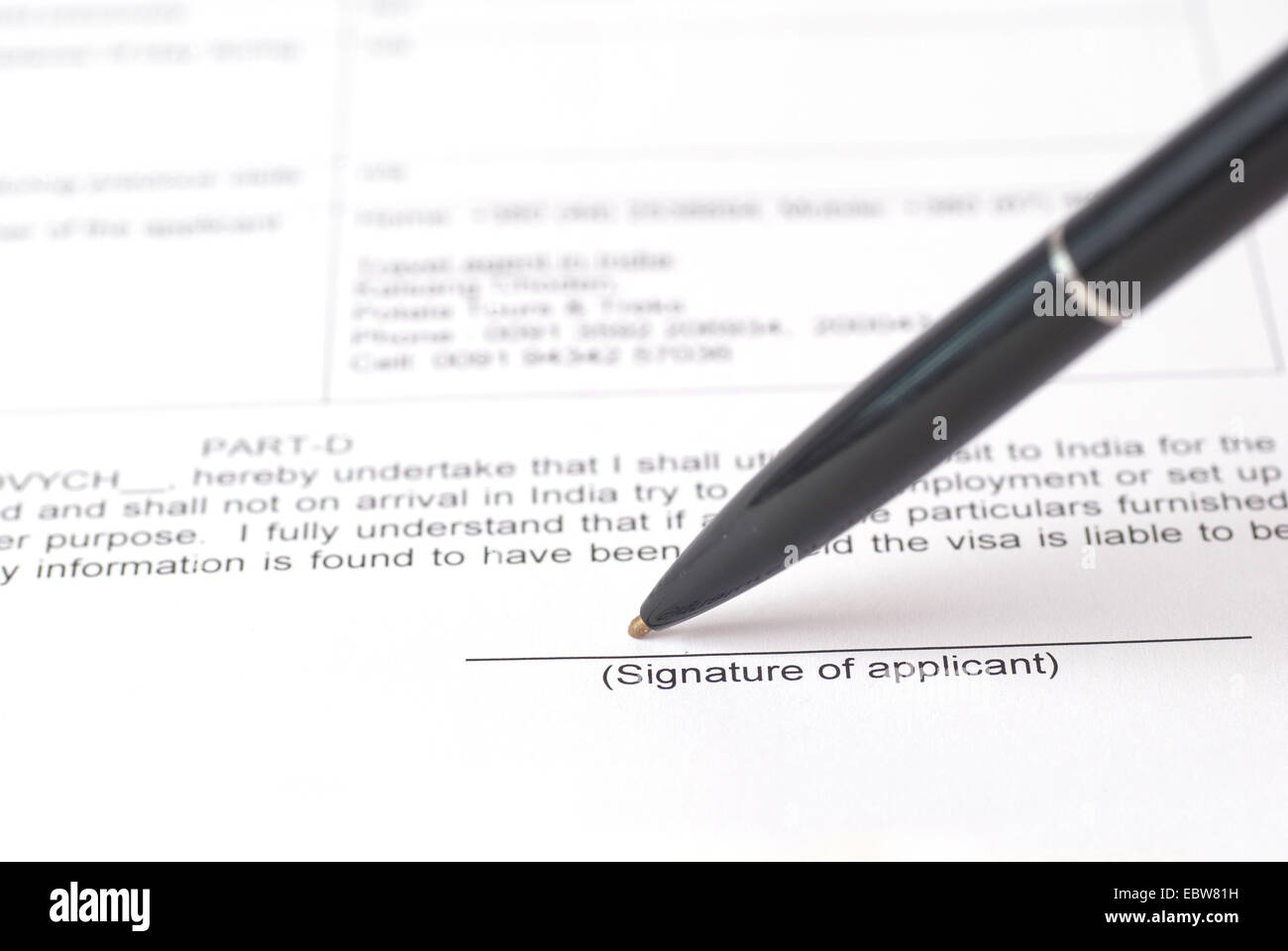 Pen signing contract. Document with place for a signature Stock Photo ...