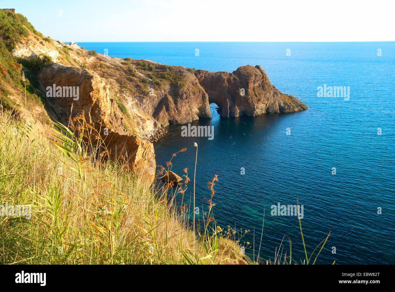 Sea landscape with grotto in the rock Stock Photo - Alamy