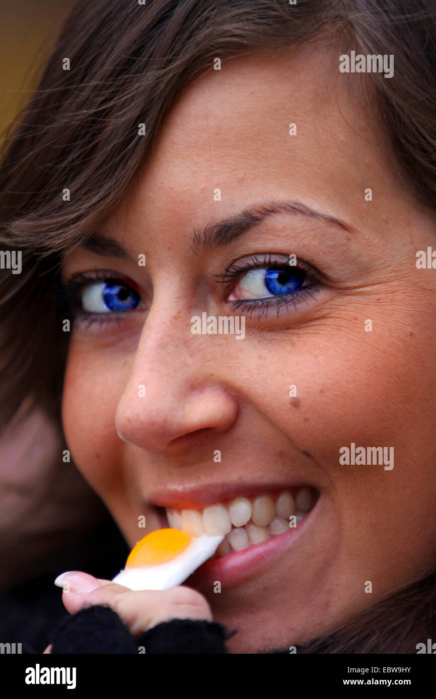 young woman eating sweets Stock Photo - Alamy