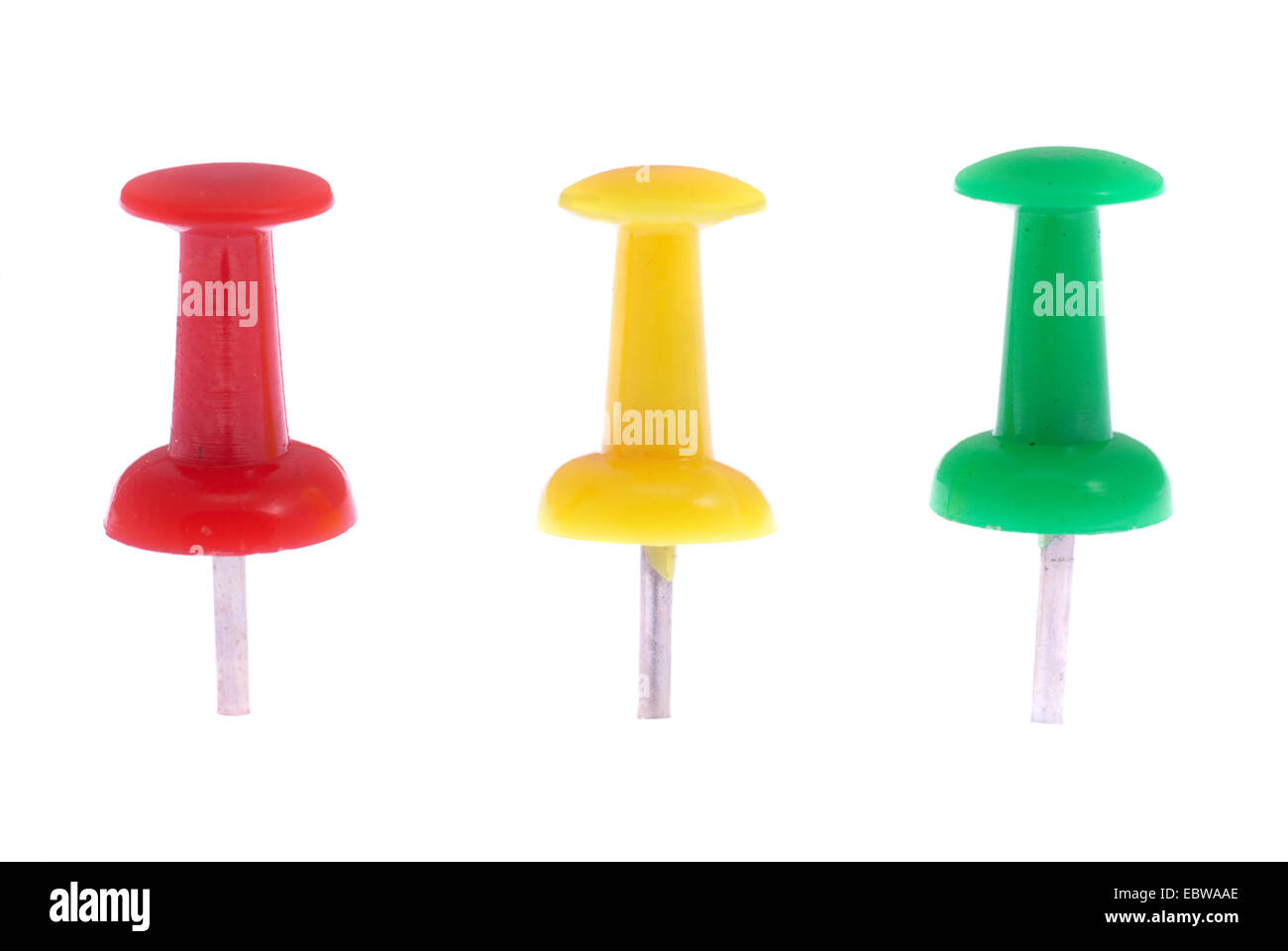 Three colored pins isolated on white background Stock Photo - Alamy