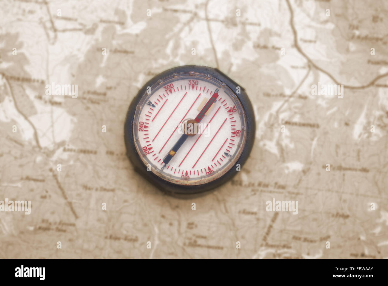 Compass over the topographic map- concept background Stock Photo - Alamy