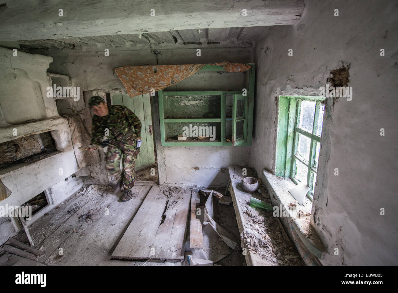 kitchen in old wooden cottage in abandoned Stechanka village, Chernobyl ...