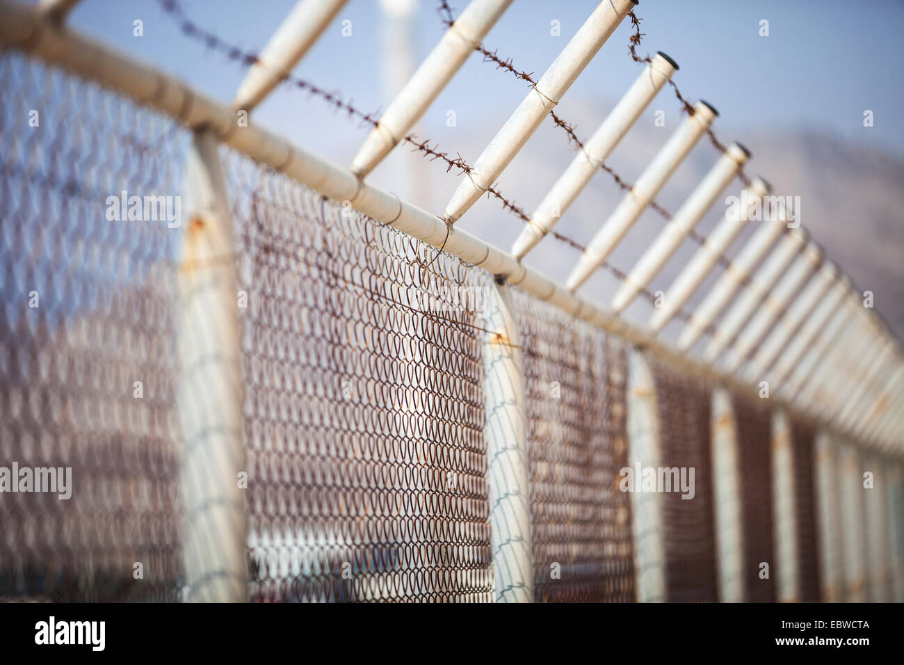 Fence with barbed wire Stock Photo - Alamy