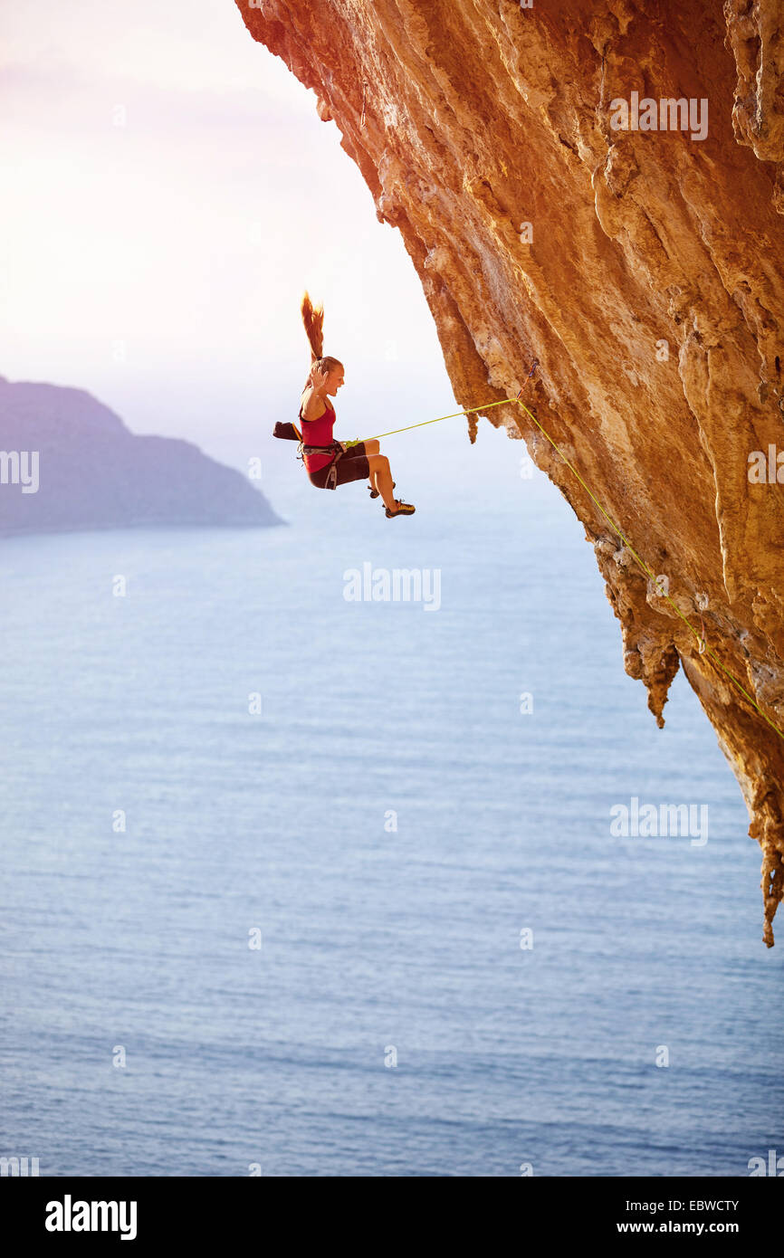 Female rock climber falling of a cliff while lead climbing Stock Photo ...