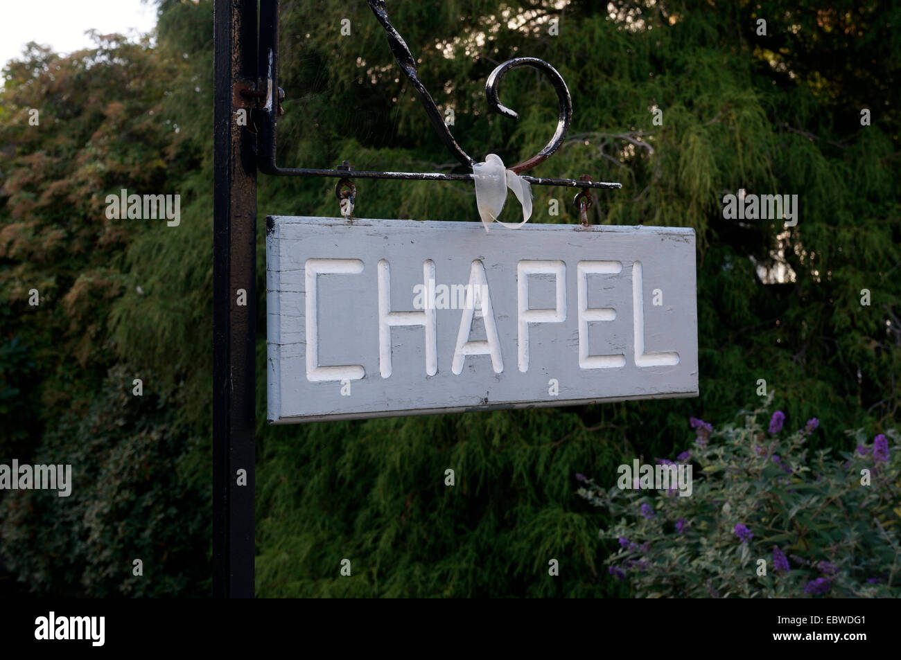 Chapel sign hanging from a black wrought iron post Stock Photo - Alamy