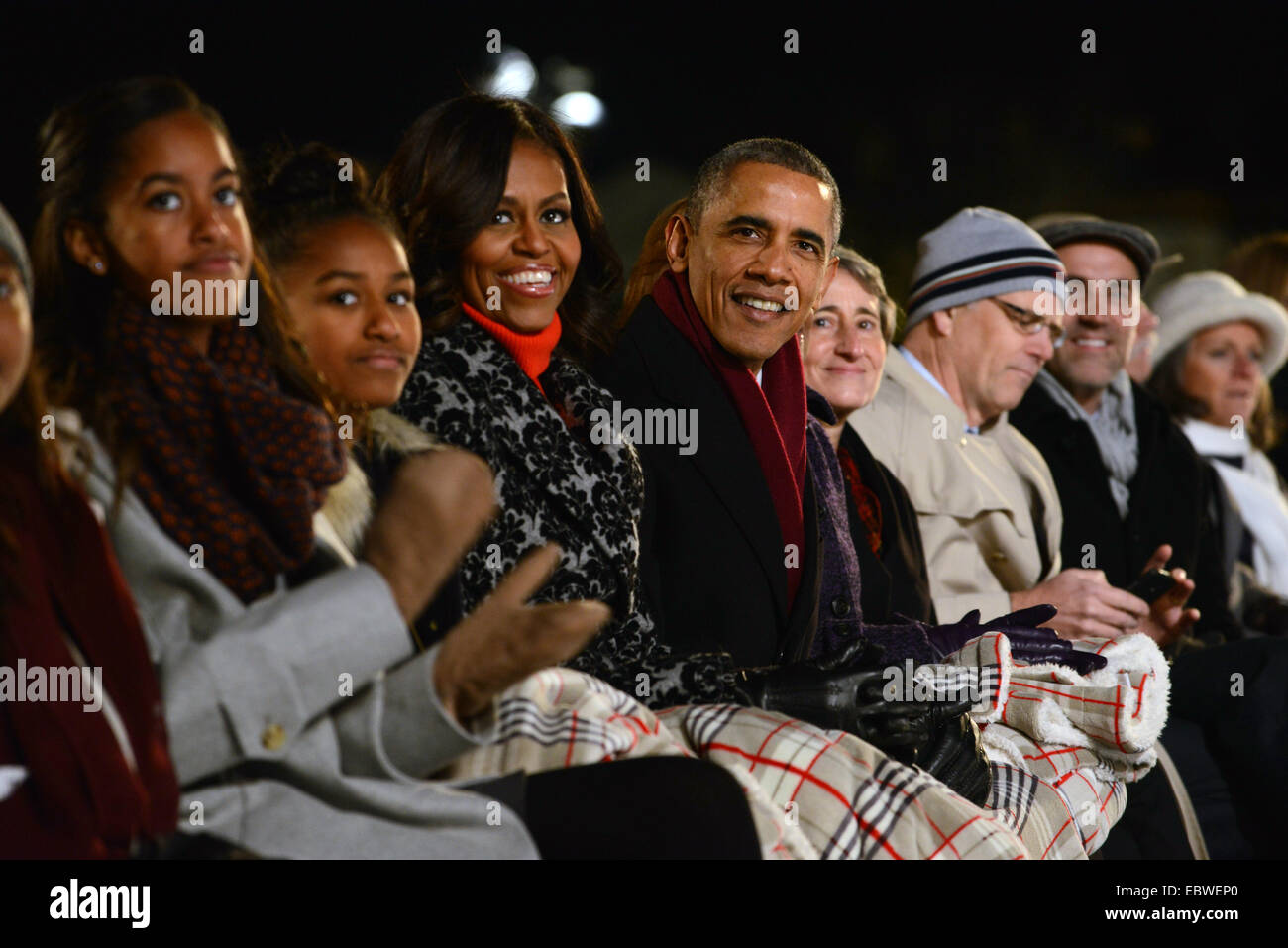 US President Barack Obama sits with First lady Michelle Obama and ...
