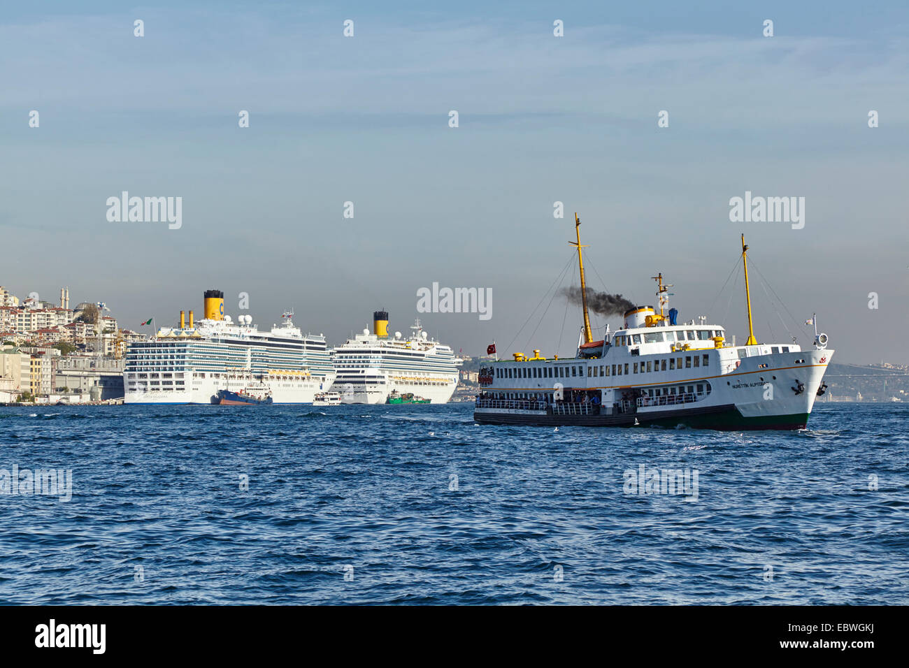 Ferry in Istanbul with two cruise ships moored on Bosphorus Stock Photo ...