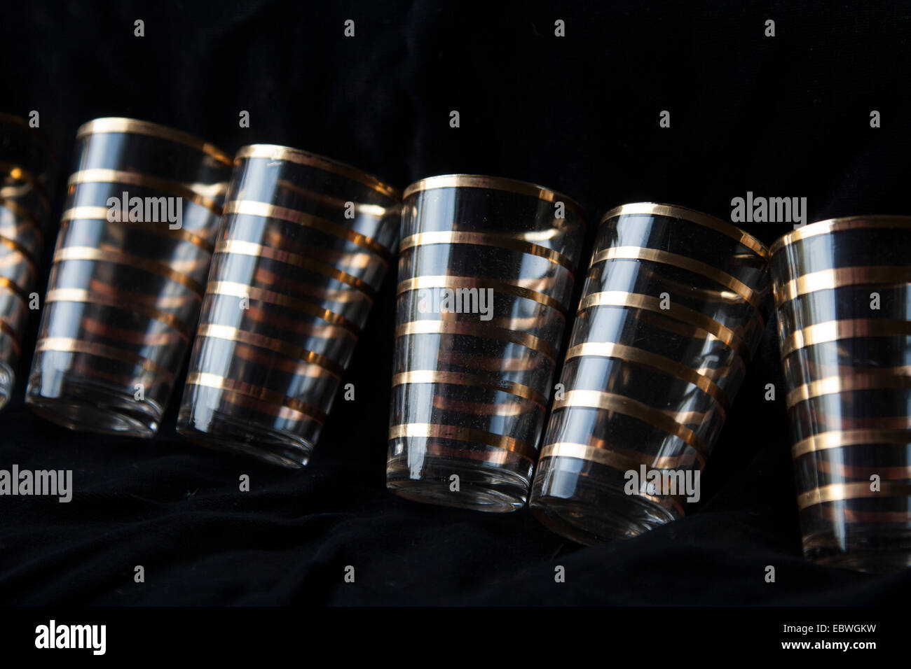 Still life of vintage glassware on a black background Stock Photo - Alamy