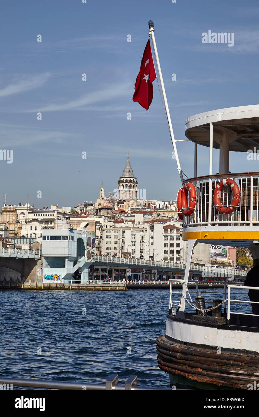 Turkish ferry with Galata bridge and tower in background Stock Photo ...