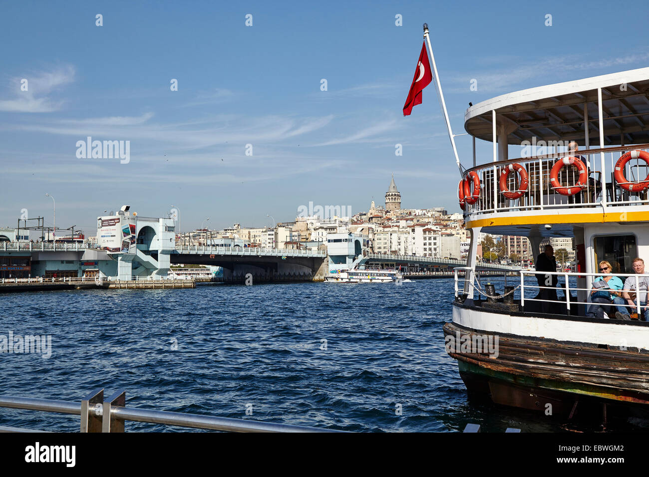 Turkish ferry with Galata bridge and tower in background Stock Photo ...
