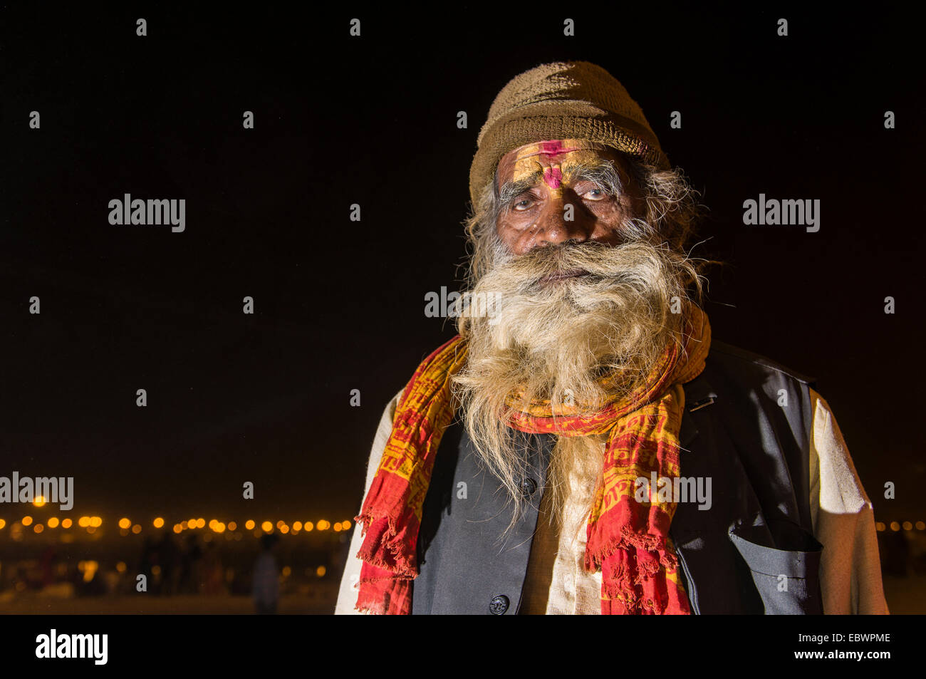 Rama sadhu, holy man, at night at the Sangam, the confluence of the ...