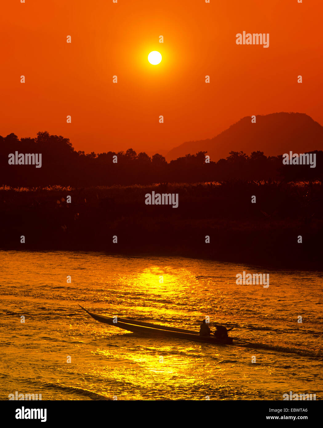 Ruea Hang Yao or long tail boat, speedboat on the Kok River, at sunset ...