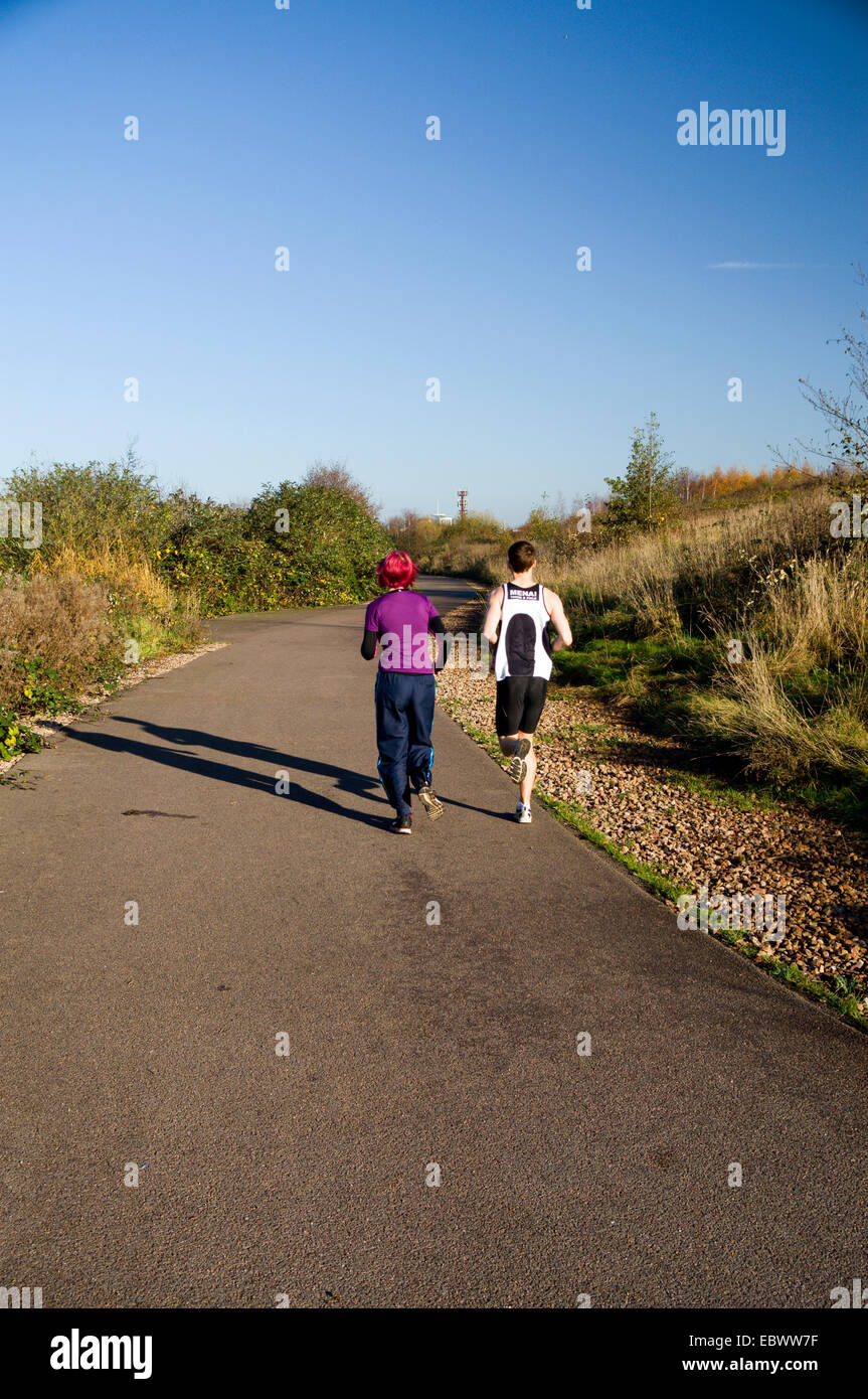 Couple running on Ely Trail, Granetown, Cardiff, Wales, UK Stock Photo ...