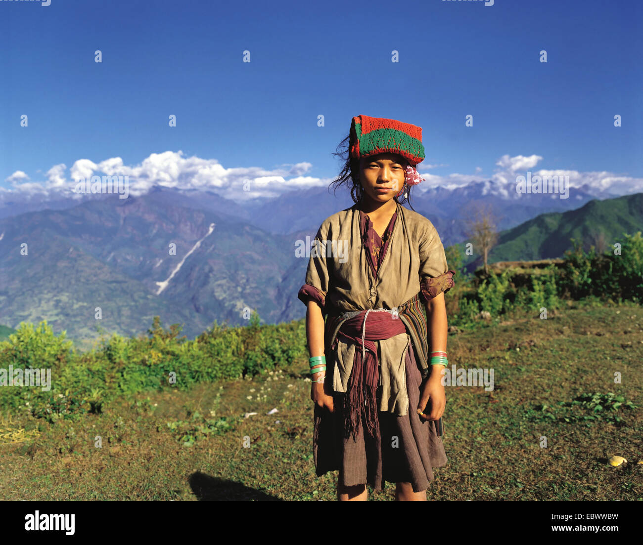 bhote girl standing in front of mountain scenery, Nepal, Makalu Barun ...