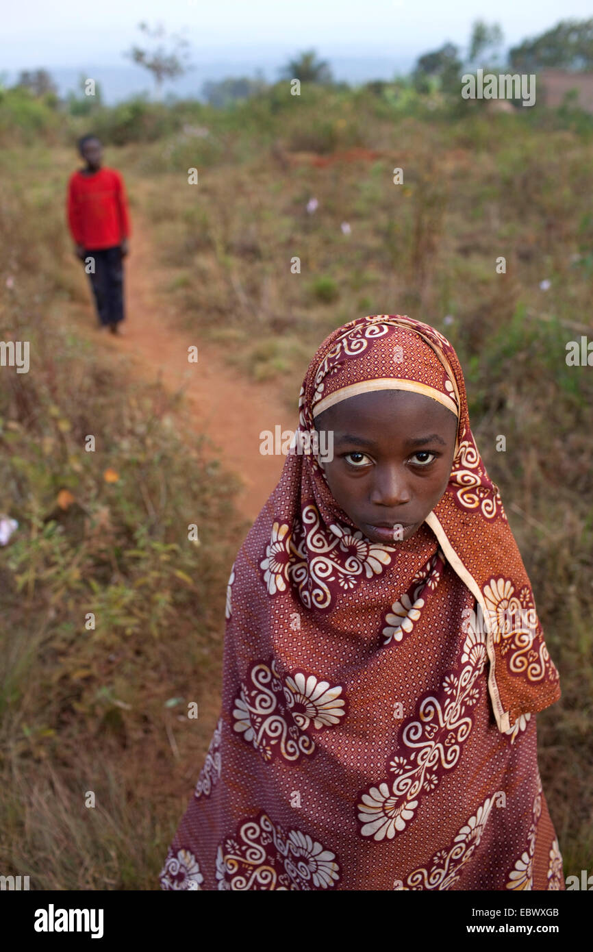 young girl in traditional african clothing on a path, Burundi, Karuzi ...