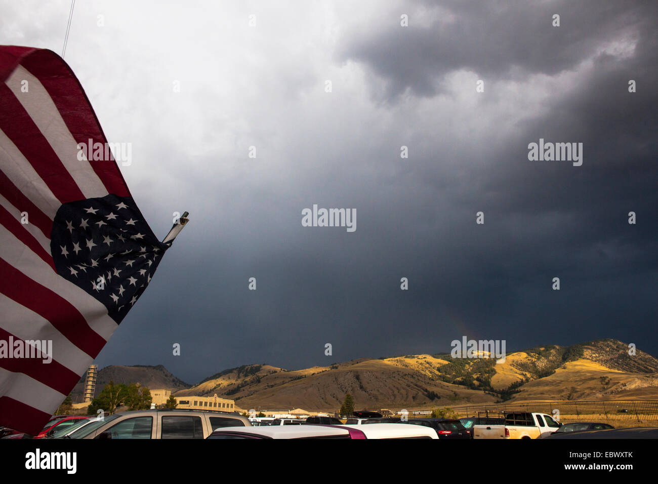 United States flag and rainbow, Gardiner, Montana, the north west ...