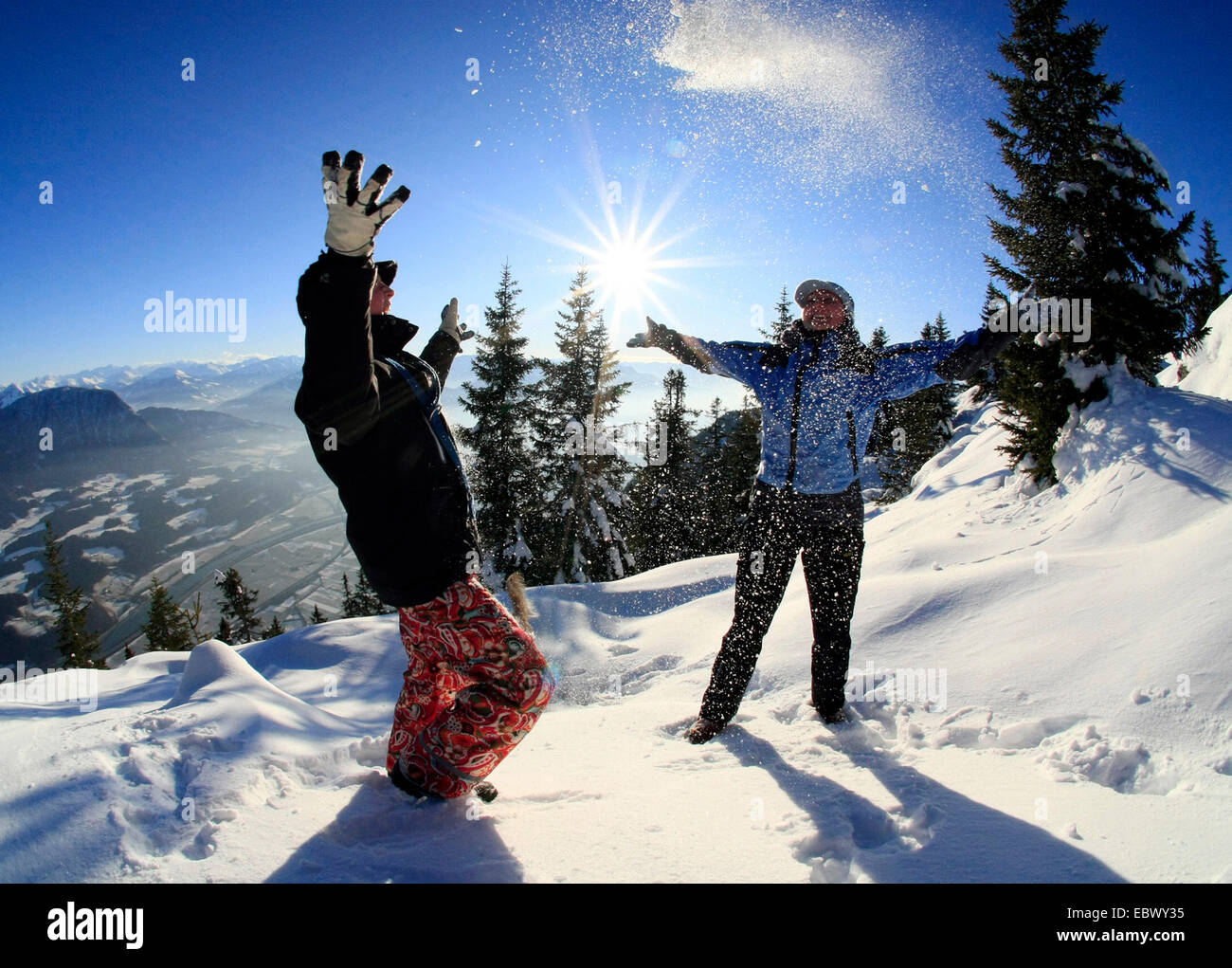 two young women having fun in the snow, Austria, Tyrol, Kufstein Stock ...