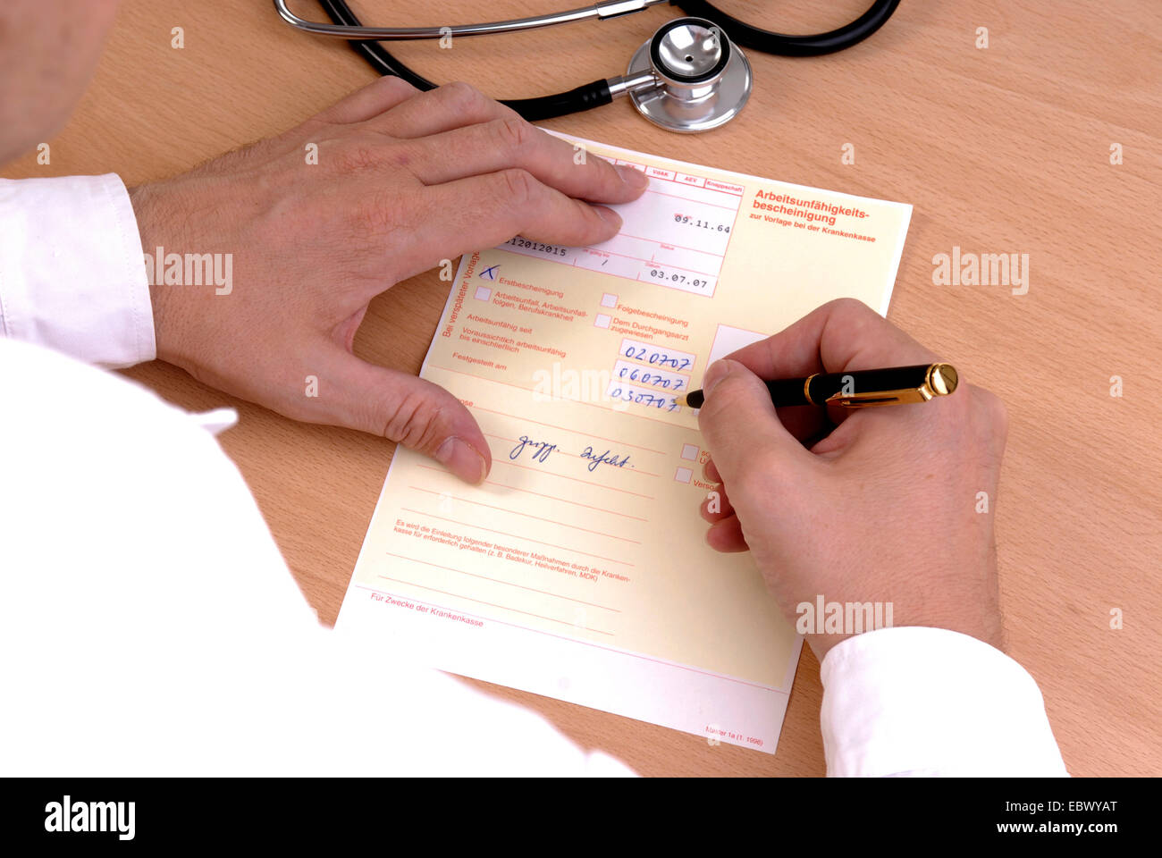doctor filling an certificate of incapacity for work Stock Photo - Alamy