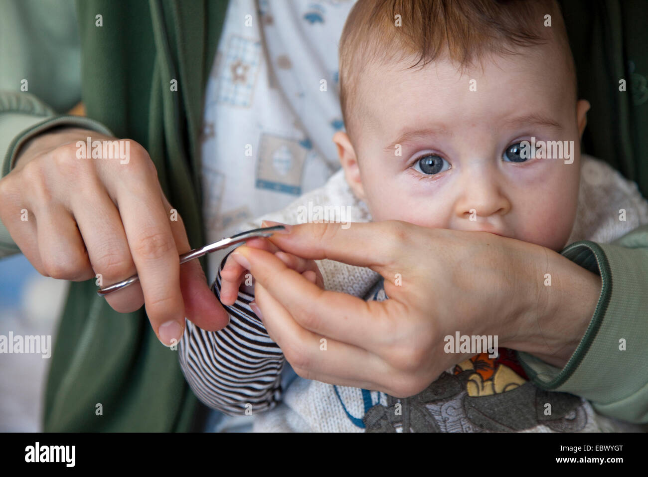baby gets pare nails Stock Photo - Alamy