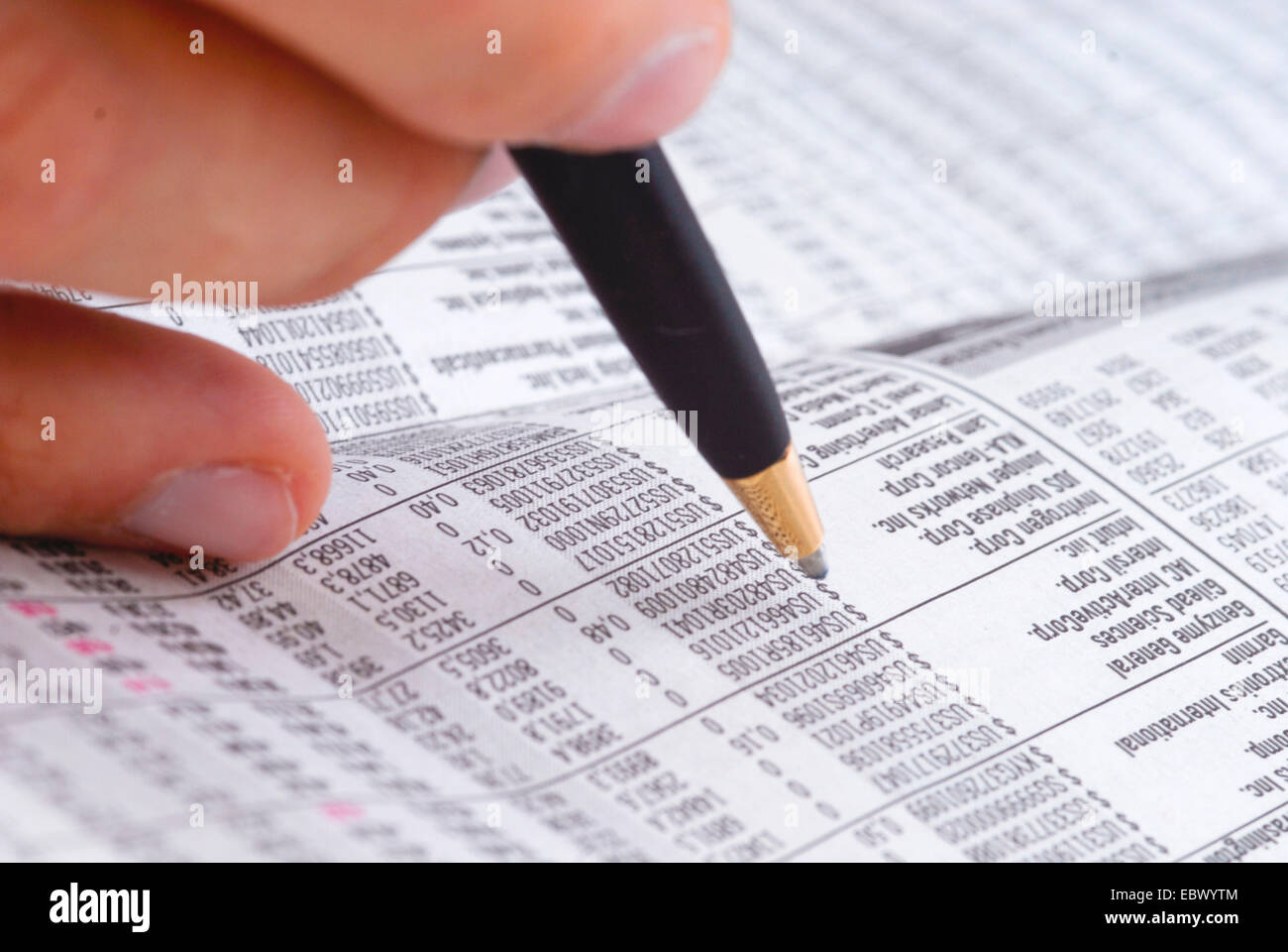 man reading a financial newspaper Stock Photo - Alamy