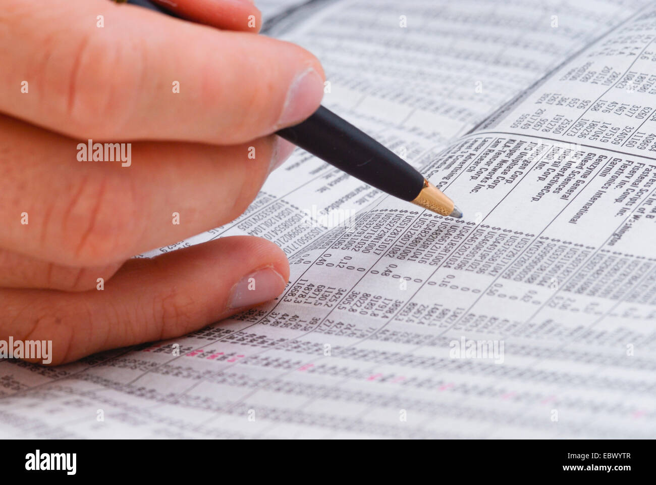 man reading a financial newspaper Stock Photo - Alamy