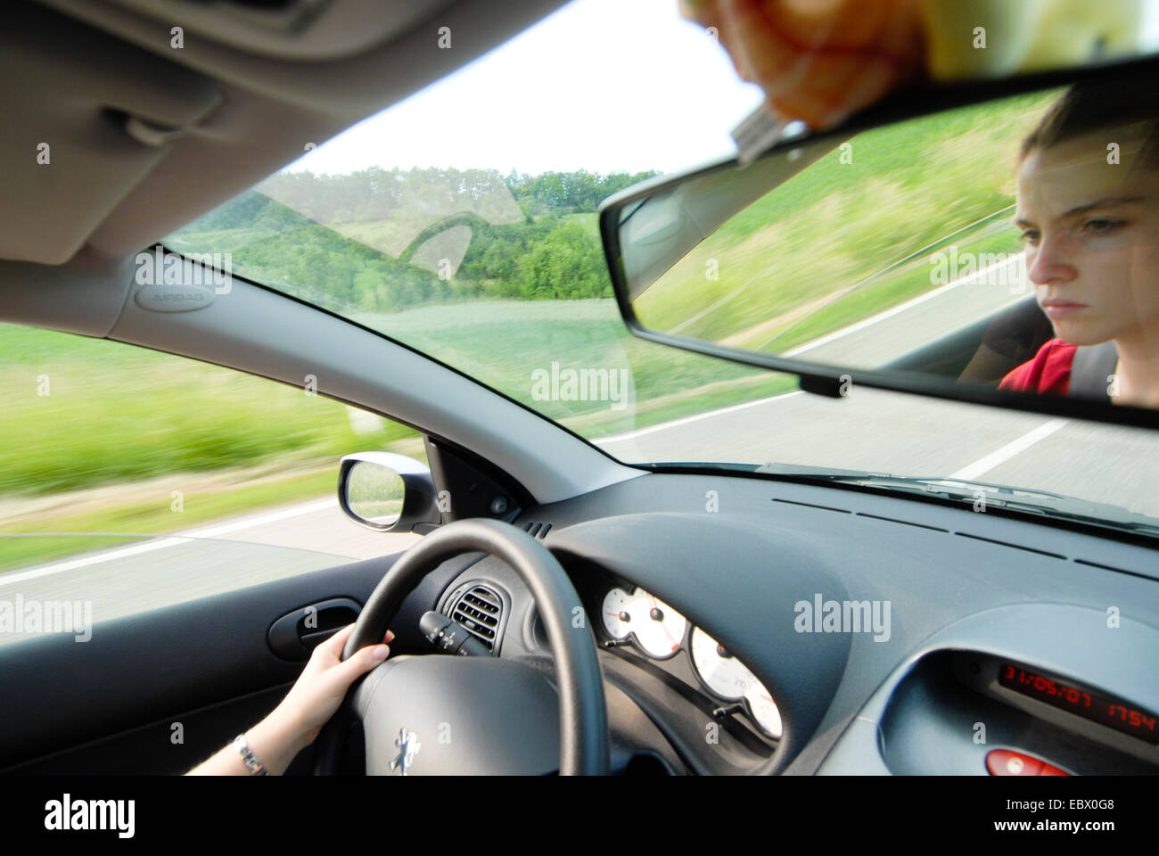 young car driver in the rear mirror, Germany Stock Photo - Alamy