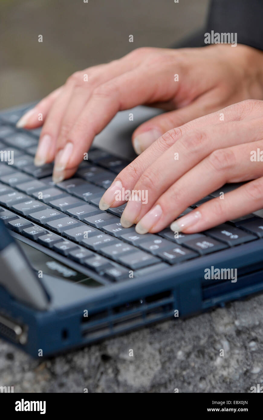 woman's hands typing on a laptop keypad Stock Photo - Alamy