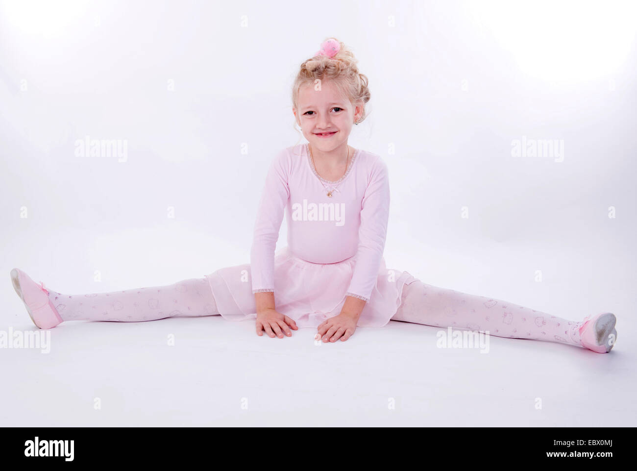 little ballet girl stretching Stock Photo - Alamy