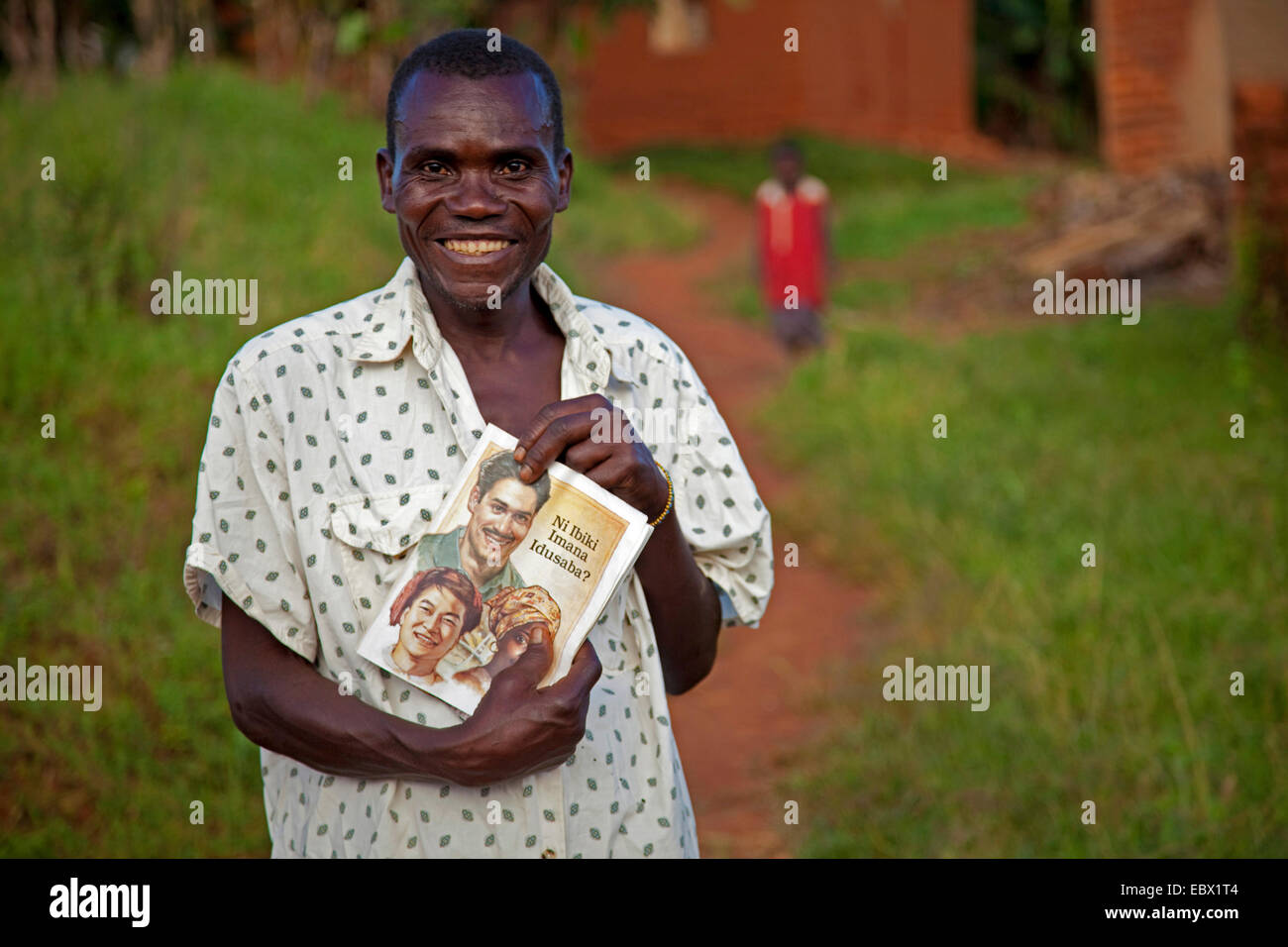 man showing a religious book, Burundi, Makamba, Makamba Stock Photo - Alamy