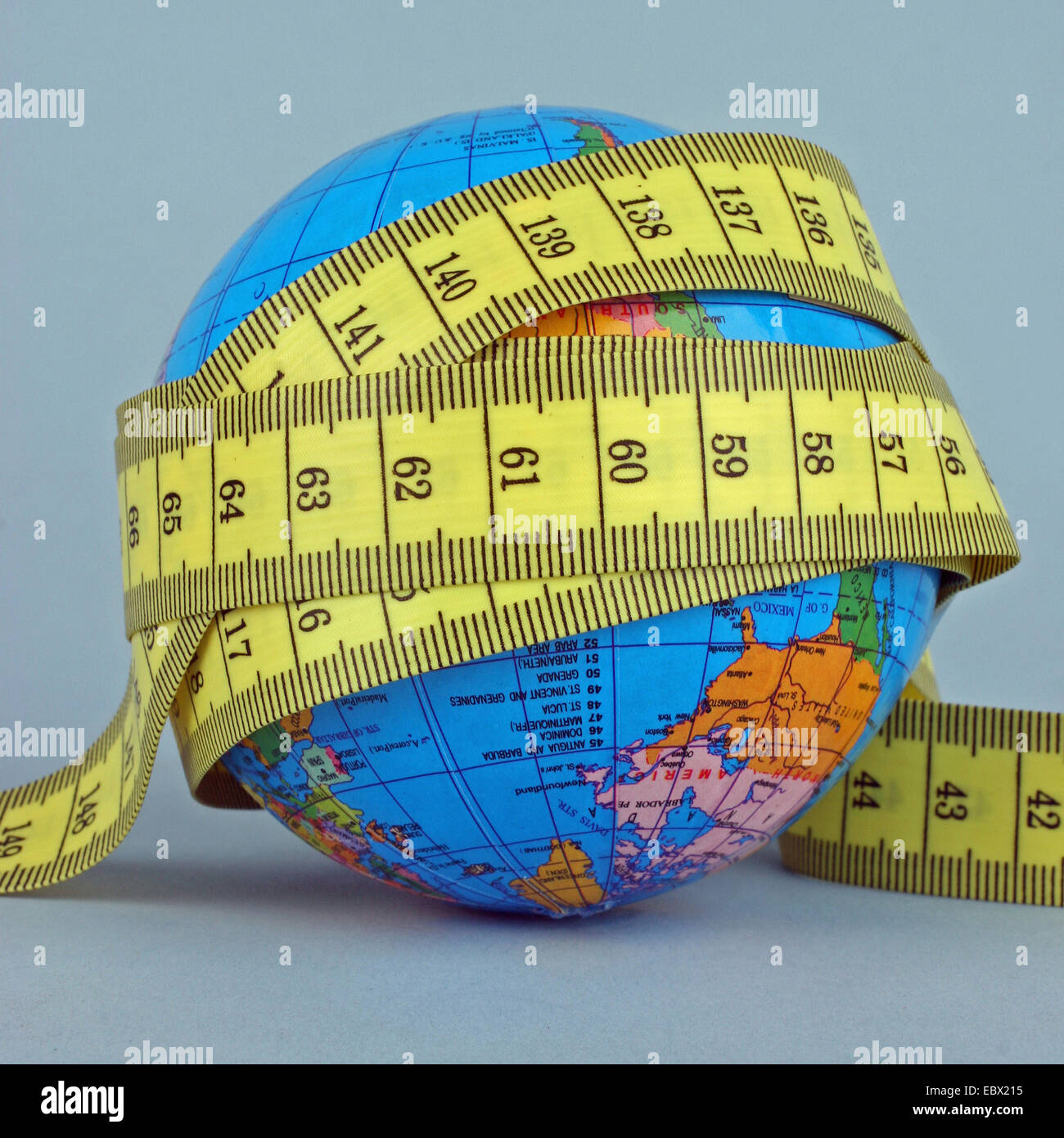 a globe and a tape measure Stock Photo - Alamy