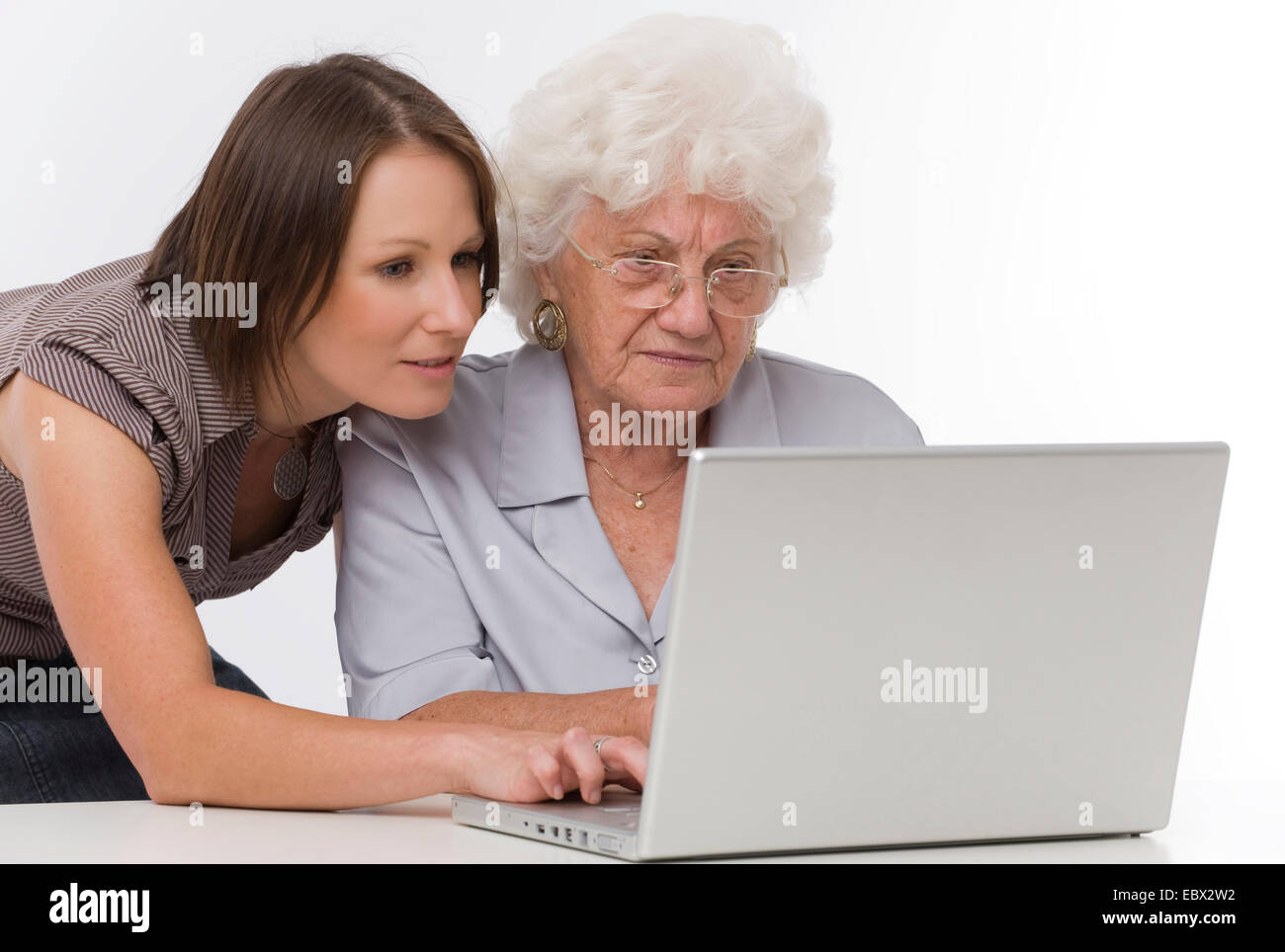 young woman helps her grandma using laptop Stock Photo - Alamy