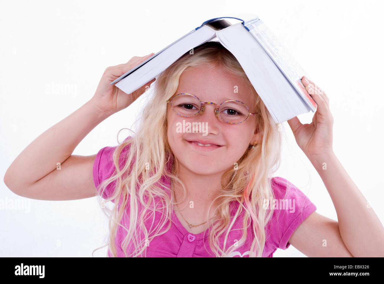Book open in front of face hi-res stock photography and images - Alamy