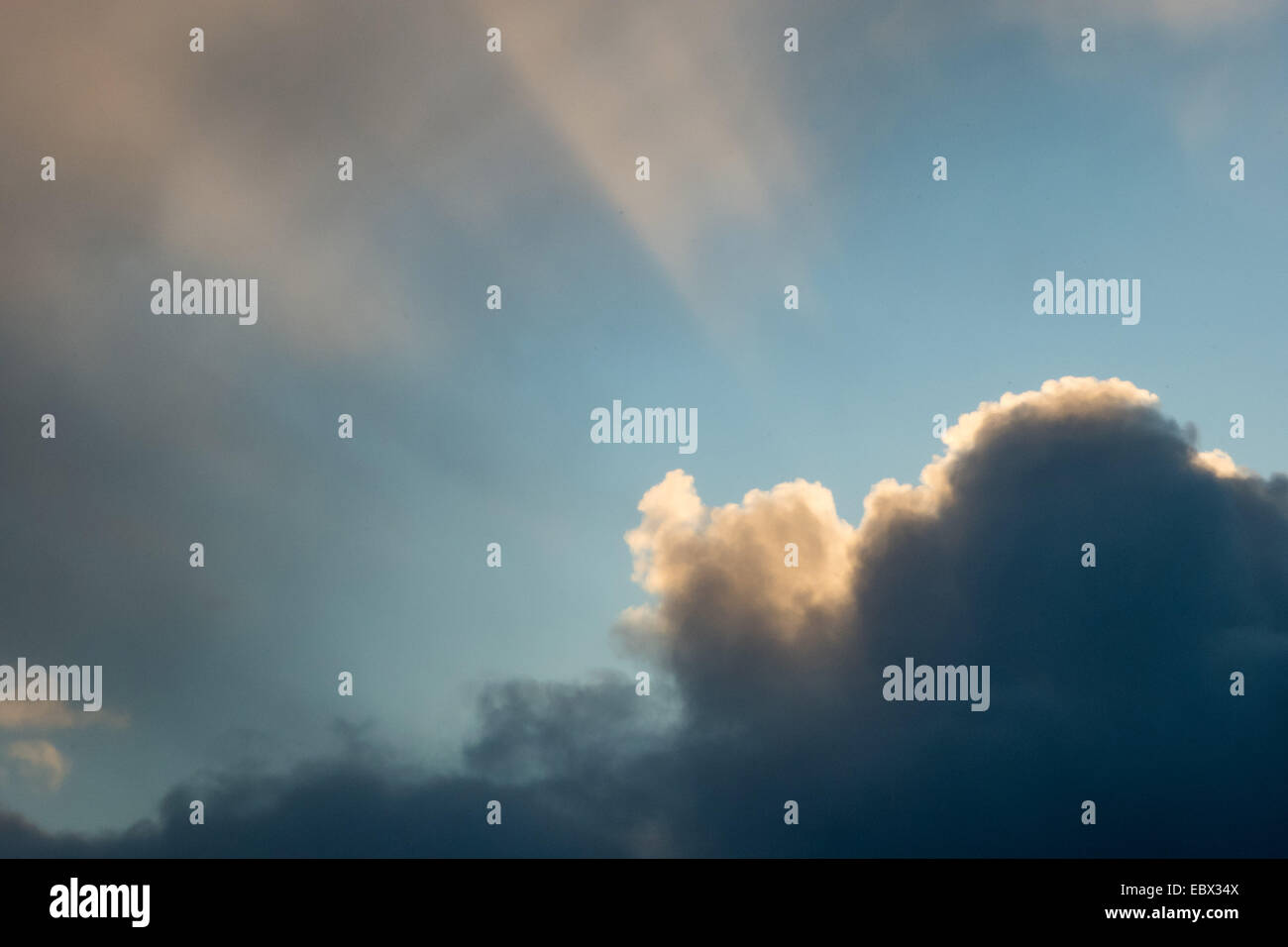 Crepuscular Rays Behind Snow Cloud Stock Photo - Alamy