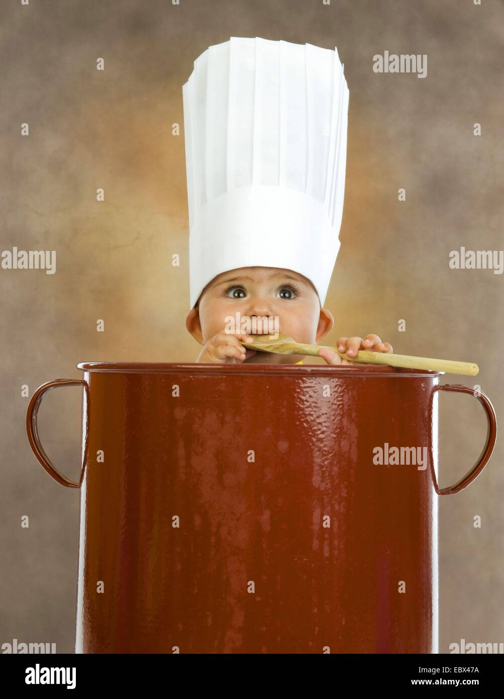 little child with chef's cap in cooking pot Stock Photo - Alamy