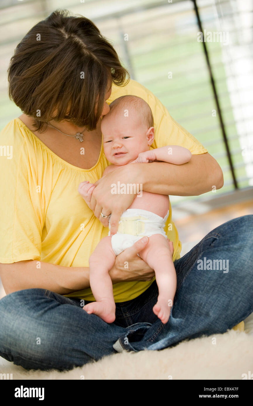 Young woman with a baby on her arm hi-res stock photography and images ...