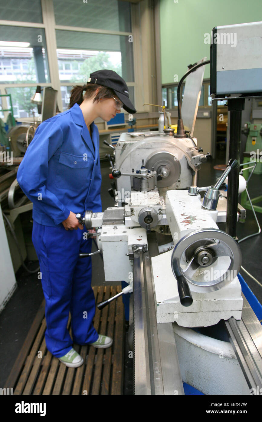 female apprentice working with machines Stock Photo - Alamy
