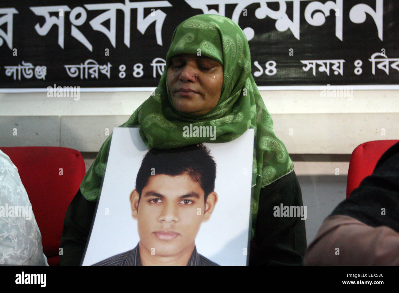 BANGLADESH, Dhaka: A Bangladeshi relative of a missing opposition activist weeps during a press ...