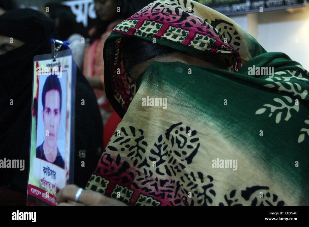 BANGLADESH, Dhaka: A Bangladeshi relative of a missing opposition activist weeps during a press ...