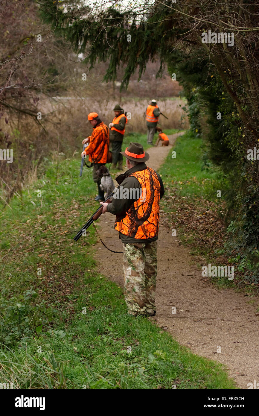 shooters of a battue surrounding a pond, Germany Stock Photo - Alamy