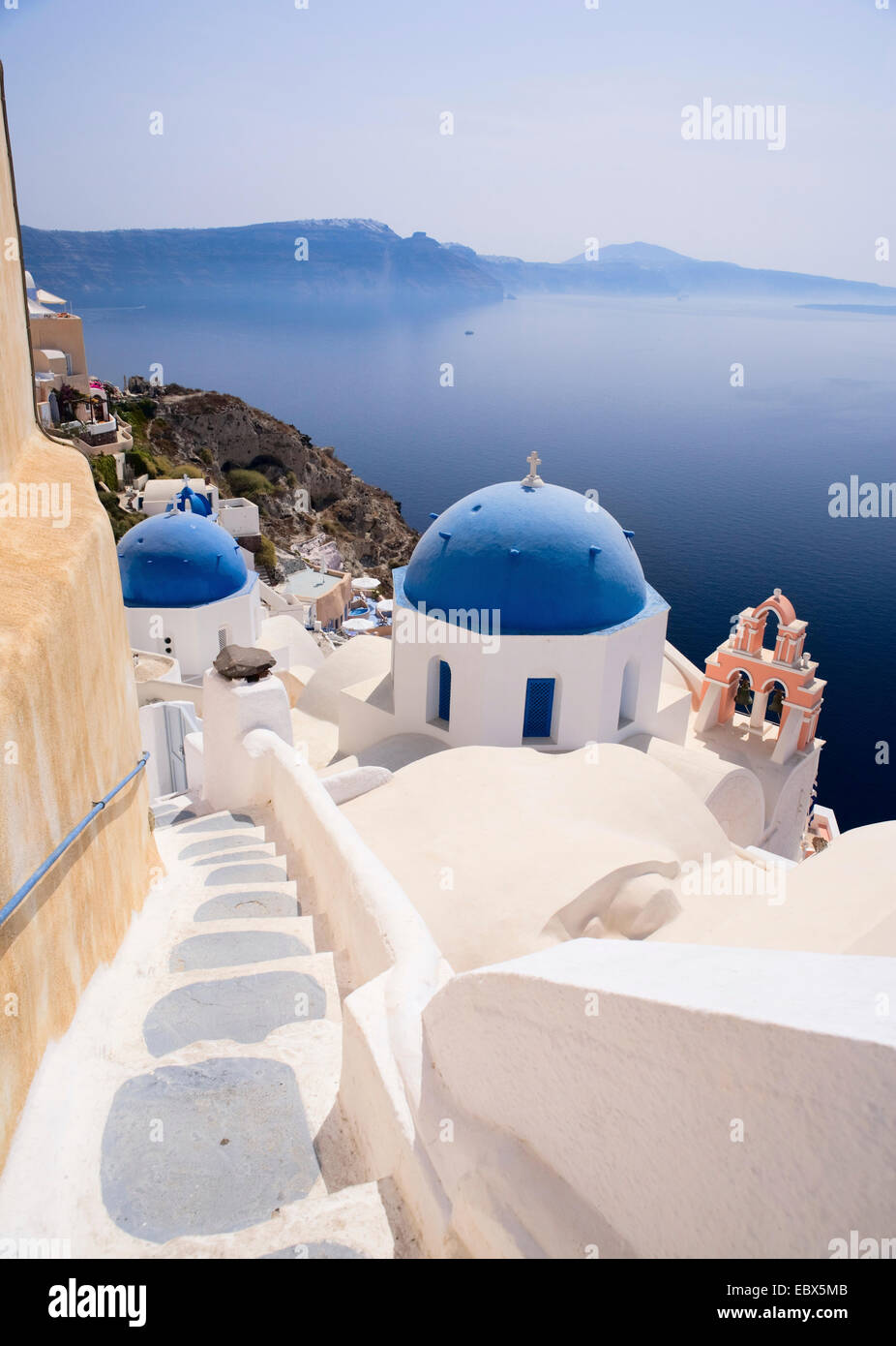 view from the cliff at the sea over the blue dome of a church, Greece ...