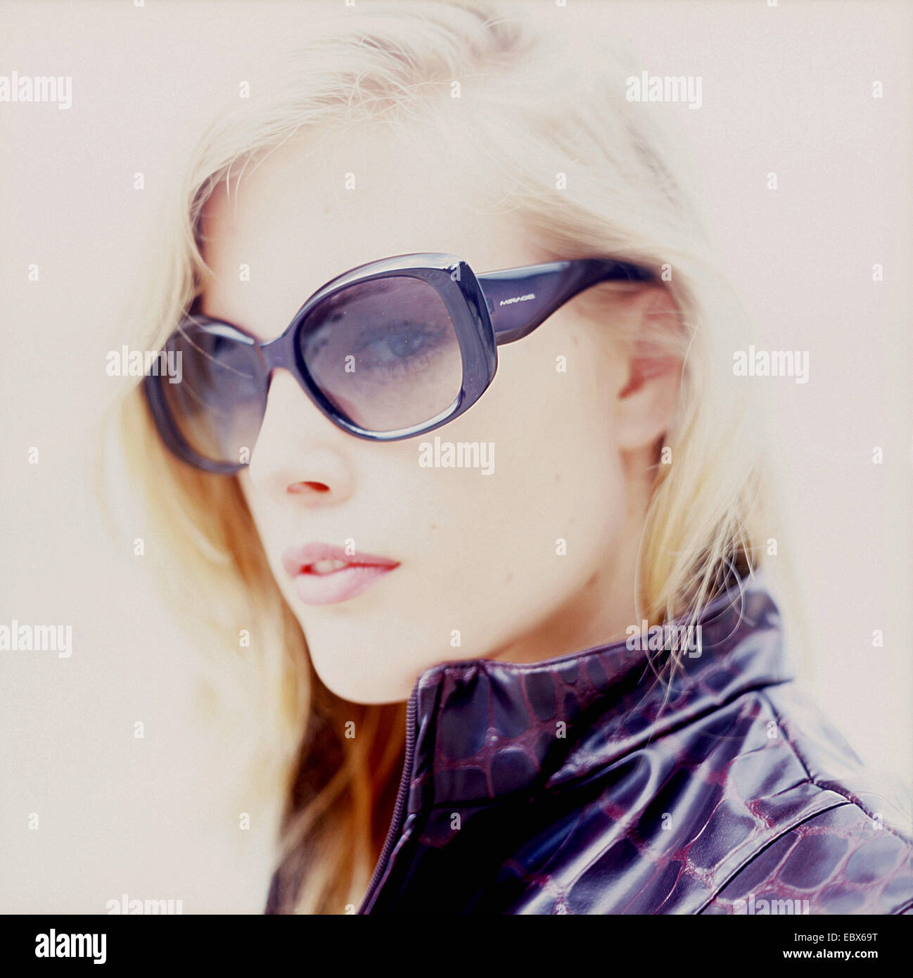 long-haired young blonde throwing a lascivious side glance through her ...